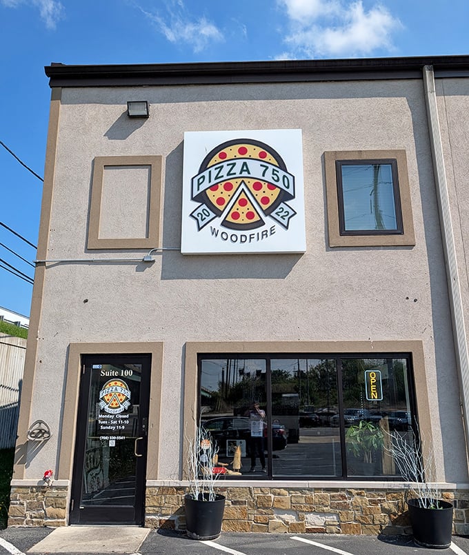 Pizza 750's unassuming exterior hides a woodfire wonderland where dough transforms into crispy, bubbly perfection.