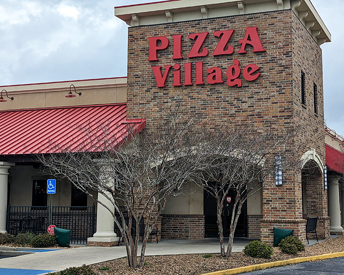 Brick, mortar, and decades of pizza tradition. The sign might as well say "Welcome Home" for Lafayette pizza lovers.