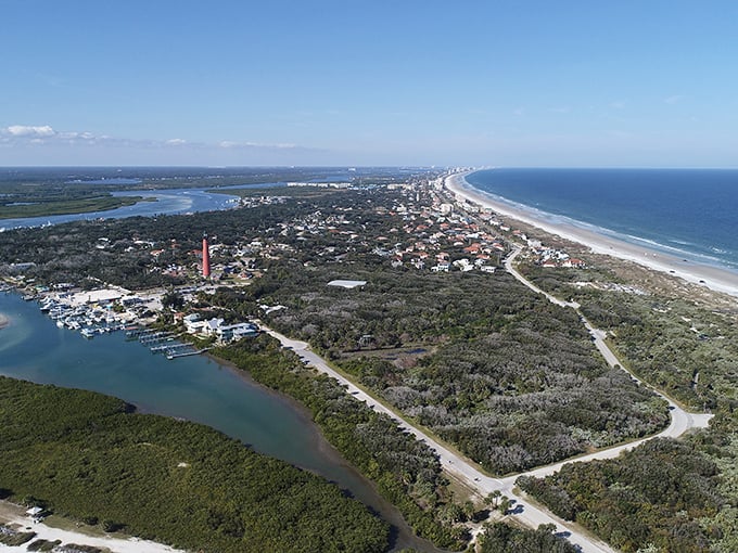 Ponce Inlet's iconic lighthouse stands tall against the blue Florida sky, a beacon for budget-conscious retirees seeking coastal charm.