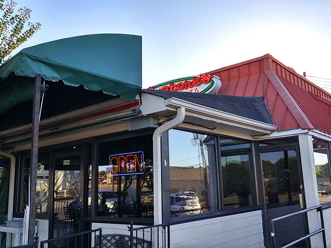 Salvatore's red awning and charming patio fountain create the perfect stage for pizza performances that deserve a standing ovation.