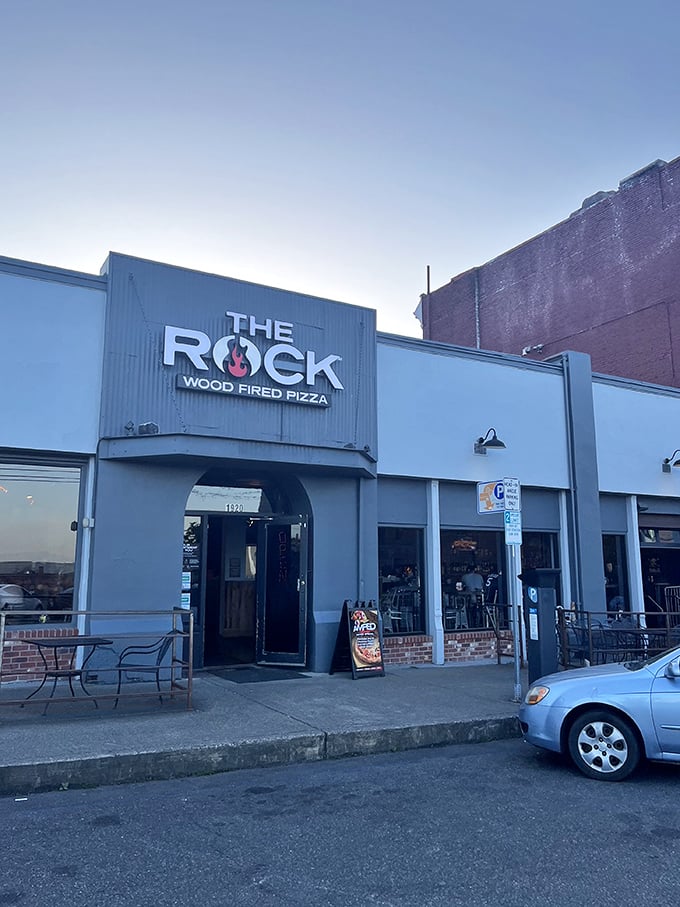 The Rock's industrial-cool exterior gives zero hints about the pizza party happening inside&mdash;like finding a concert venue that happens to serve incredible pies.