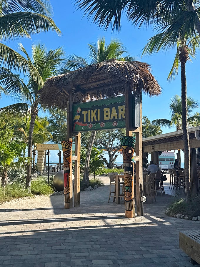 Where tiki dreams meet ocean reality. Those wooden posts have welcomed sun-soaked visitors seeking rum-based happiness for generations.