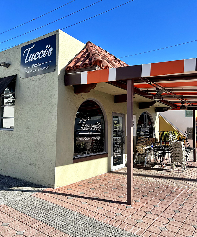 Tucci's cheerful awning is like a beacon for pizza lovers&mdash;promising coal-fired magic that transforms simple dough into crusty gold.