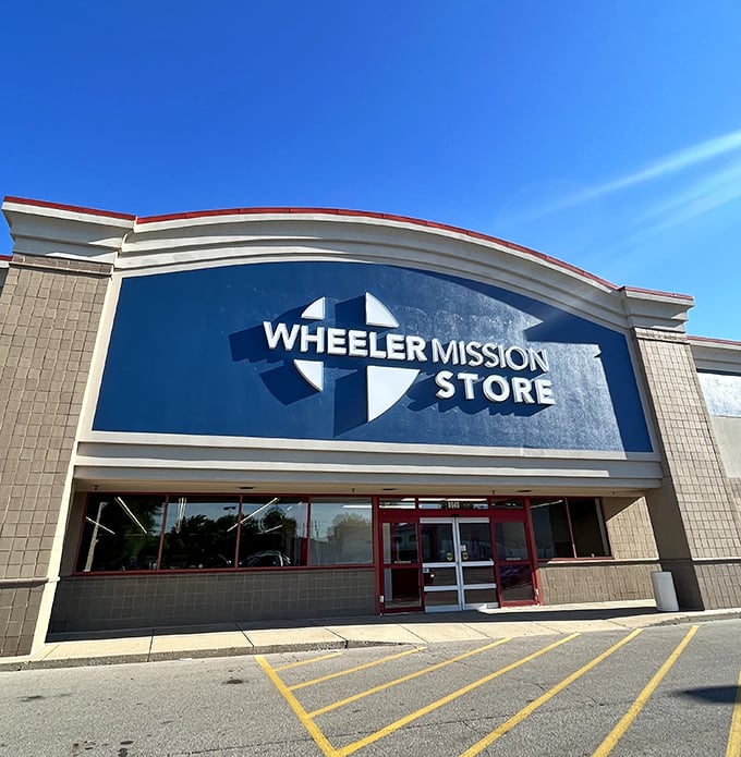 That curved blue sign means serious thrifting ahead. Wheeler Mission Store: where shopping and compassion meet.