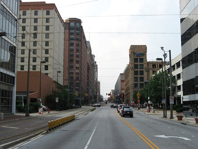 Downtown Baltimore's urban canyon creates a concrete symphony where modern life pulses through historic veins.