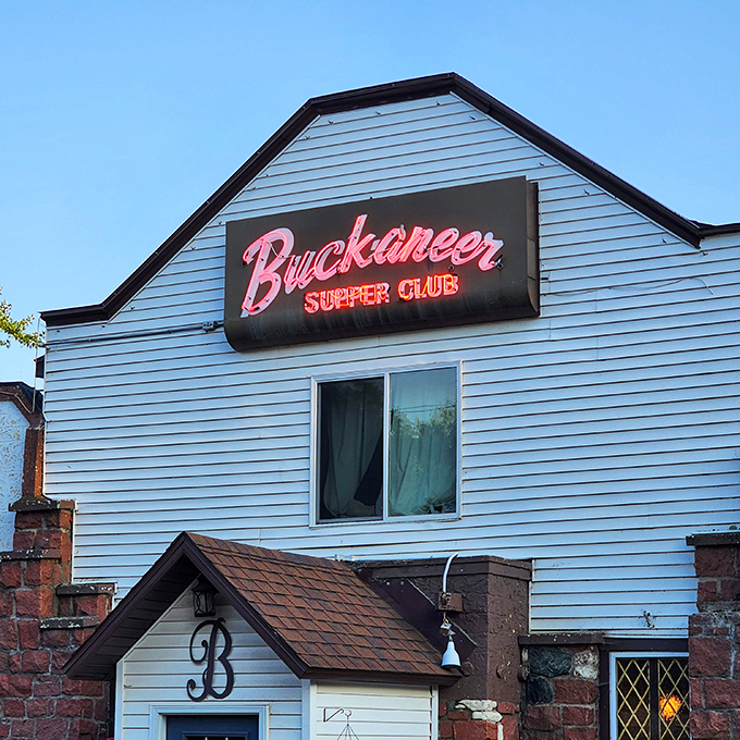 That pink neon script isn't just signage – it's a beacon of hope for the seriously steak-deprived.