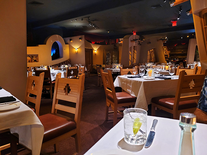 Dining room magic at Cactus Creek, where those curved walls and soft lighting make every table feel like the best seat in the house.