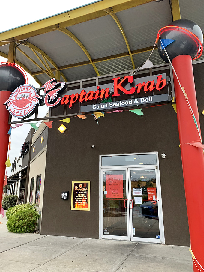 The bright red sign promises Cajun seafood adventures&mdash;where bibs aren't just suggested, they're practically mandatory!