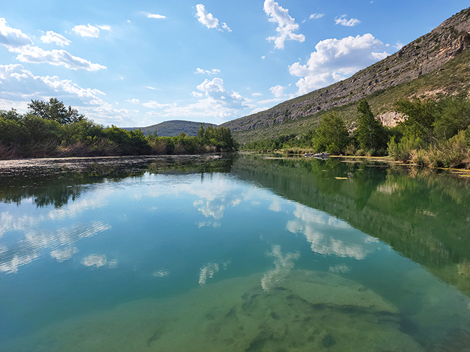 Limestone canyons frame Devils River's impossibly blue waters. It's like Texas secretly borrowed a piece of the Caribbean when nobody was looking.