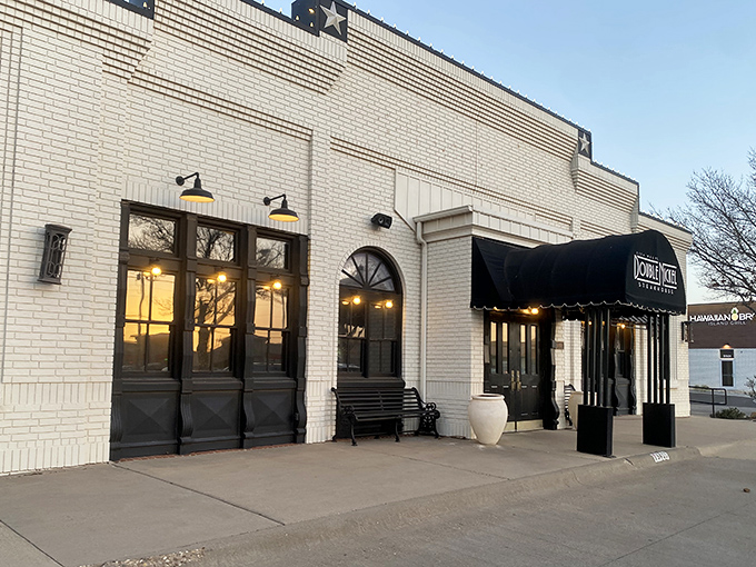 Those arched windows frame the promise of an evening where your only job is enjoying every savory bite.