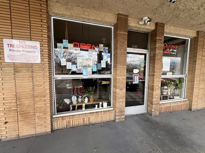 Pizza paradise incognito! Giovanni's modest exterior keeps the secret&mdash;but that neon sign is the bat signal for hungry locals.