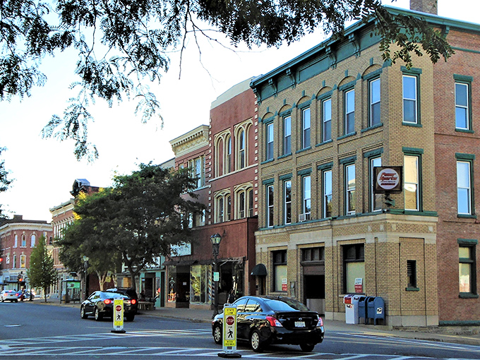 The gentle curve of Gloversville's main thoroughfare reveals layers of history in its well-preserved commercial buildings.