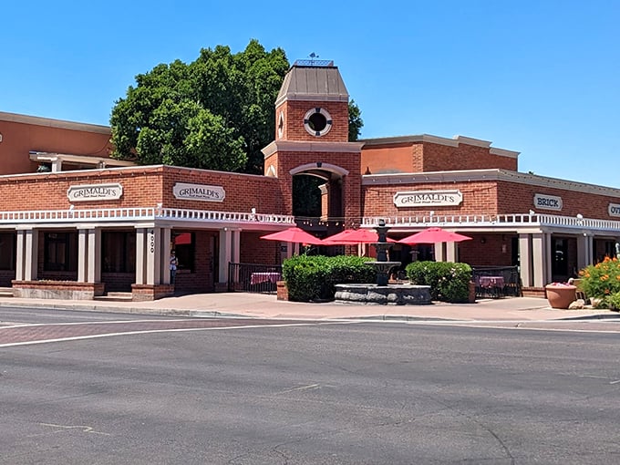 Red umbrellas and a charming courtyard create the perfect setting for pizza that would make any Sicilian grandmother weep with joy.