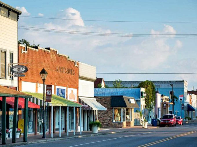 Sunlight plays across Jennings' charming storefronts. The kind of Main Street that makes you want to open a quirky little shop selling... something!