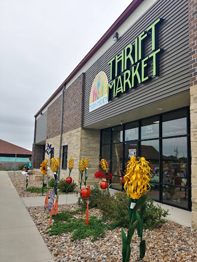 Whimsical metal flowers greet thrifters at Many Hands, where shopping second-hand feels first-class and surprisingly uplifting.