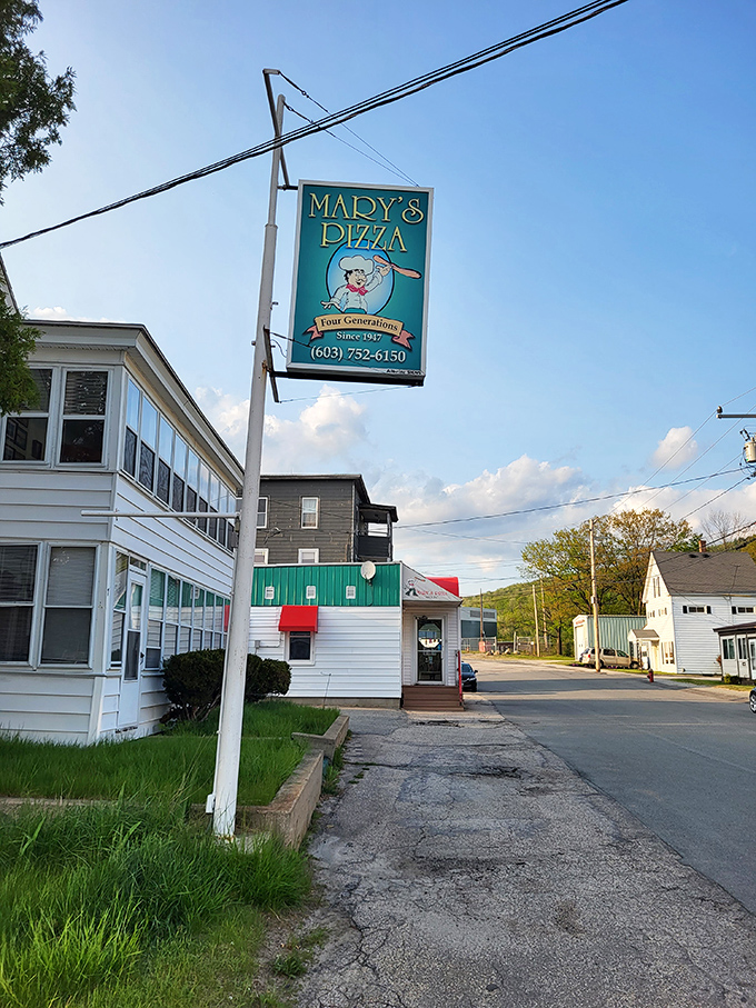 That "Four Generations" sign isn't just marketing - it's the secret ingredient that makes Mary's Pizza worth the drive to Gorham.