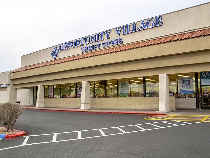 The sprawling Opportunity Village storefront stretches wide, ready to fulfill your thrifting dreams. Those windows offer tempting glimpses of treasures within!