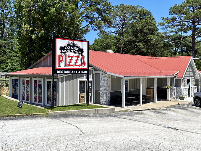The red roof peeks through the trees like a pizza mirage, promising mountain-sized portions after a day of Branson adventures.