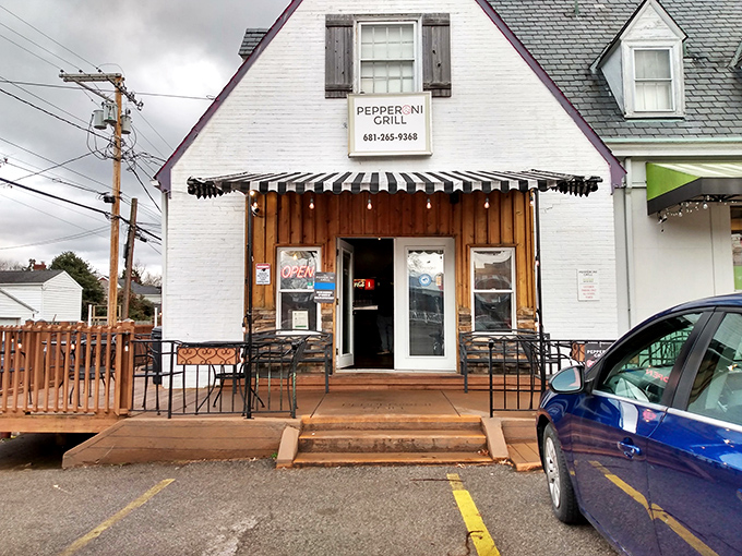 Rain or shine, that cheerful entrance to Pepperoni Grill promises comfort in the form of perfectly crispy, cheesy pies.