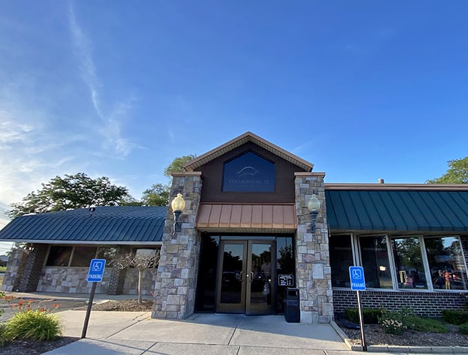 The welcoming entrance to Steakhouse 22 looks like the gateway to a beef sanctuary. Those stone accents aren't just for show!
