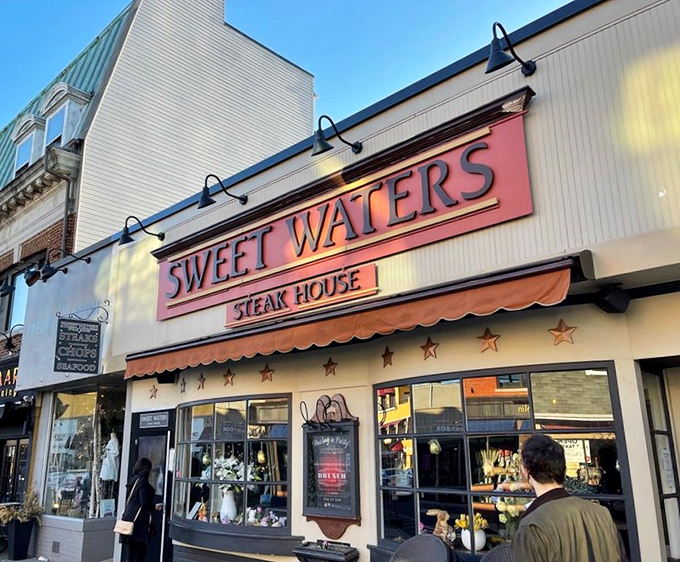The Sweet Waters sign glows like a beacon for hungry wanderers. Follow the light to steak paradise!