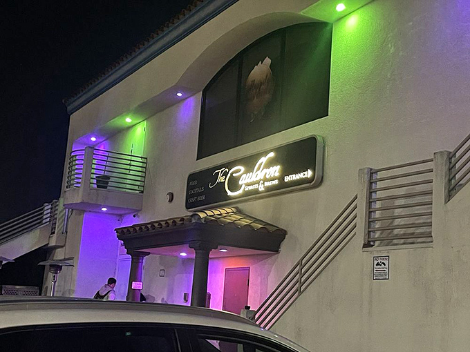 The Cauldron: Purple lights and mystical vibes set the stage for cocktails that might just transform you&mdash;or at least your evening.