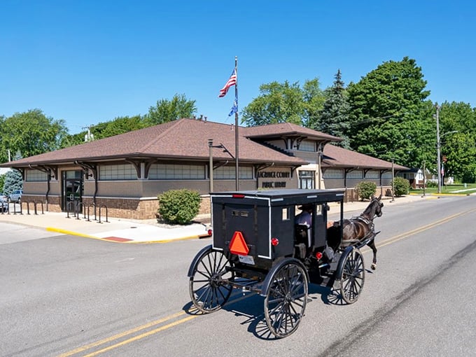 The Topeka Post Office stands proudly as a buggy passes by &ndash; mail delivery happens at the same pace, rain or shine.