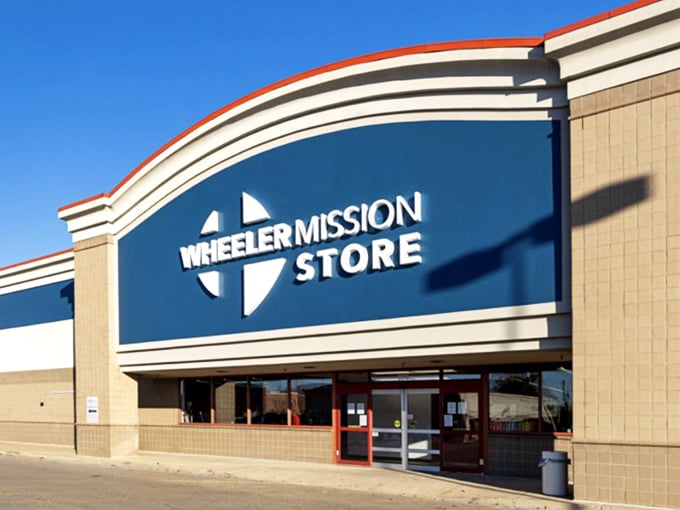 Crisp signage against a bright blue sky - the thrill of the hunt begins at the front door!