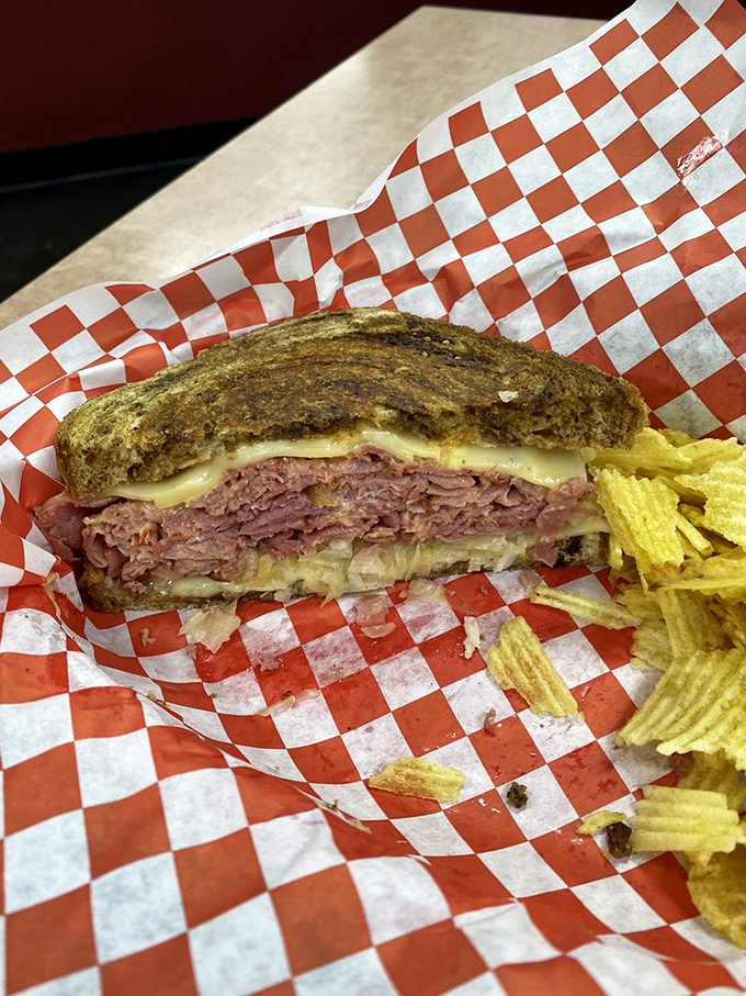 Look at that cross-section! Like a geological marvel of sandwich strata&mdash;meat, cheese, and sauerkraut in perfect harmony.