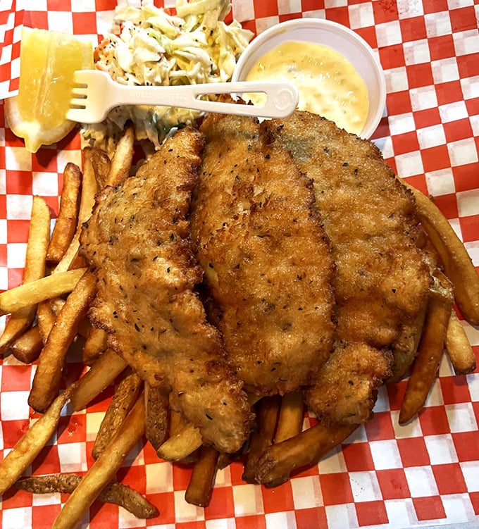 Three pieces of fish that could convert even the most devoted meat-eater. The holy trinity of seafood satisfaction served on classic red-checkered paper.
