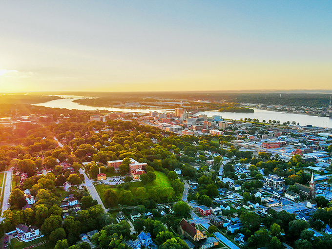 From above, the Mississippi River cradles the landscape like nature's own welcome mat. The river and town have been dance partners for centuries.