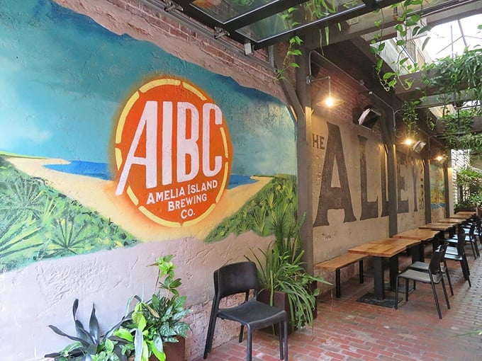 Amelia Island Brewing Company's garden seating area proves that beer gardens don't need lederhosen to create spaces where conversations flow as freely as the taps.
