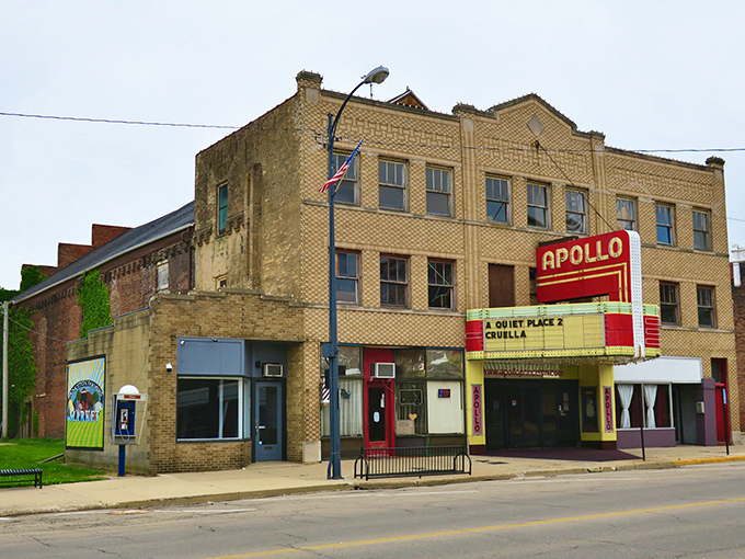 The Apollo Theatre's classic marquee glows with nostalgia, offering movie magic without the big-city prices or the confusion of 27 different viewing formats.