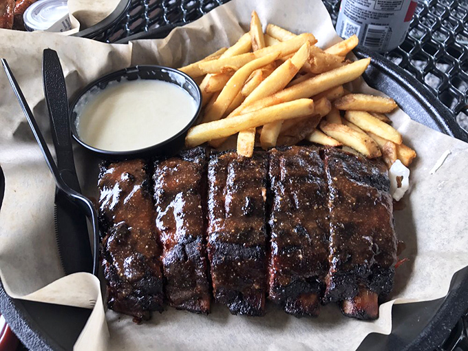 Ribs with that perfect bark and a side of golden fries. This isn't just food&mdash;it's edible architecture with a foundation of smoke, time, and patience.