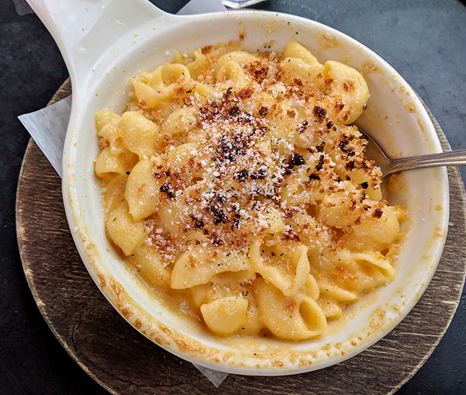 Comfort food elevated to an art form. This isn't just mac and cheese&mdash;it's a warm hug in a ceramic dish with a crispy top hat.