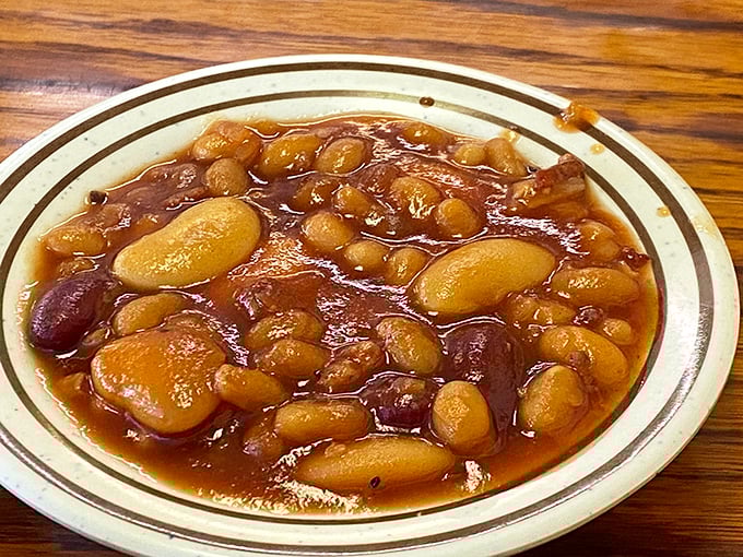 These baked beans aren't just a side dish; they're a simmering pot of molasses-kissed comfort with surprise meat treasures throughout.