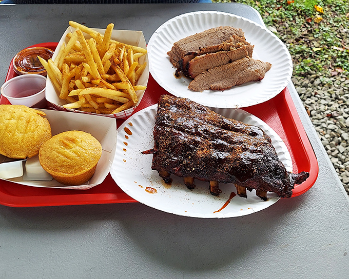 The barbecue trifecta: ribs with that perfect bark, brisket with the telltale smoke ring, and sides that refuse to be overshadowed.