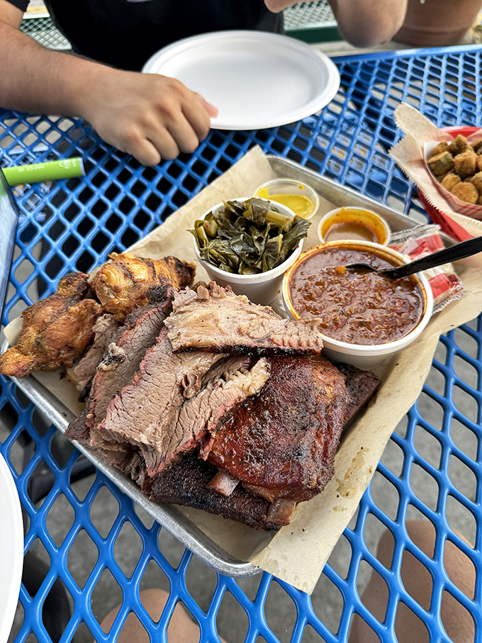 The barbecue platter that launched a thousand road trips. Tender slices of brisket, collard greens, and sides that refuse to be upstaged.