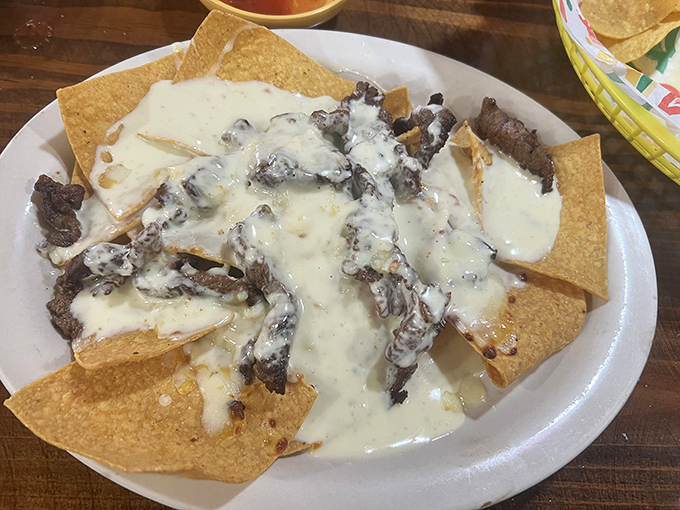 Beef nachos done right &ndash; where every chip gets its fair share of melty cheese and seasoned meat. No naked chips left behind!