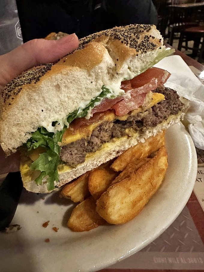 The poppy seed bun adds that perfect textural contrast, like nature's sprinkles for grown-ups who take their burgers seriously.