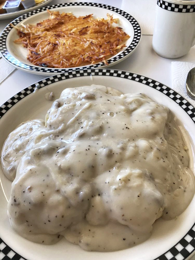 Biscuits hidden beneath an avalanche of peppery gravy. This isn't a meal &ndash; it's a comfort food archaeological dig worth every calorie.