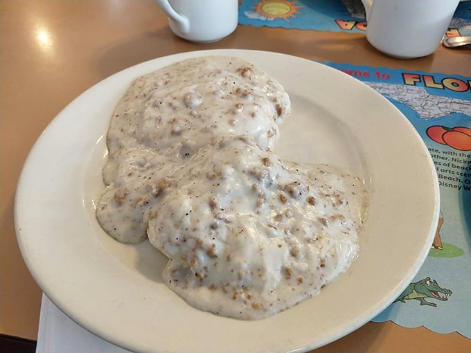 Biscuits and gravy that would make your Southern grandmother nod in approval – a velvety, peppery blanket of comfort food perfection.