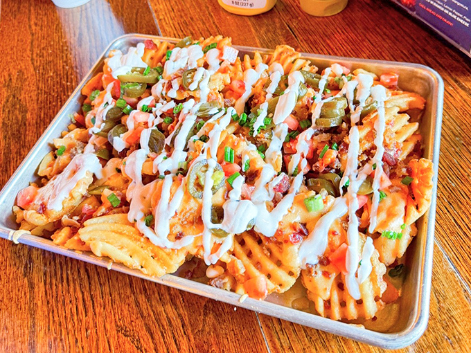 Boone Fries might look like a beautiful mess, but there's artistry in that drizzle of sauce, strategic placement of jalape&ntilde;os, and generous toppings.