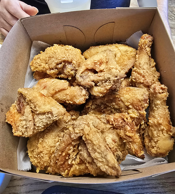 The box might be plain cardboard, but what's inside is culinary gold&mdash;crispy, juicy pieces that make you forget your table manners.