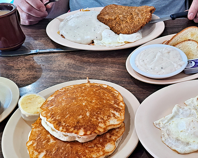 The breakfast spread that launches a thousand road trips &ndash; golden pancakes alongside country fried steak that would make any farmer nod in approval.