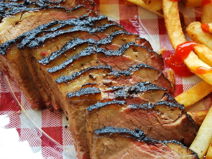 This brisket's smoke ring tells a story of patience and expertise. Each slice represents hours of low-and-slow dedication.