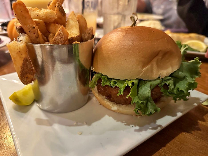 This isn't just a burger&mdash;it's a masterclass in comfort food architecture, with perfectly seasoned fries standing at attention in their metal cup.
