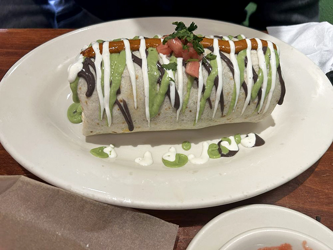 Behold the burrito in its natural habitat&mdash;sauced, garnished, and ready to make you forget every sad airport version you've ever regretted ordering.