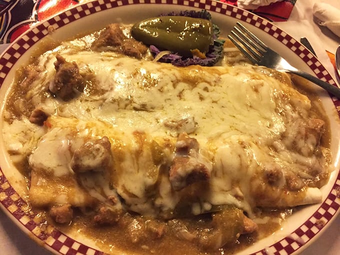 This burrito isn't just food; it's architecture&mdash;a masterpiece of construction where cheese cascades over perfectly seasoned meat like a dairy waterfall.