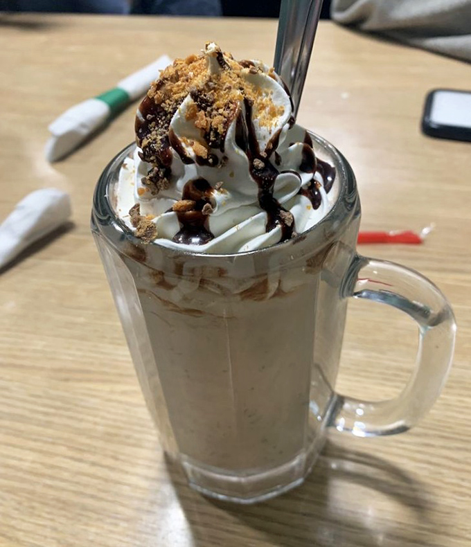 Not just a milkshake, but a dessert experience. Butterfinger crumbles cascade over whipped cream in this glass of pure indulgence.
